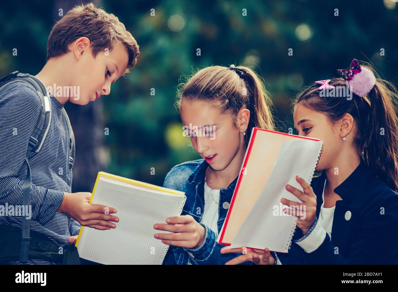 Back to school. Children with backpacks are having fun, talking ...