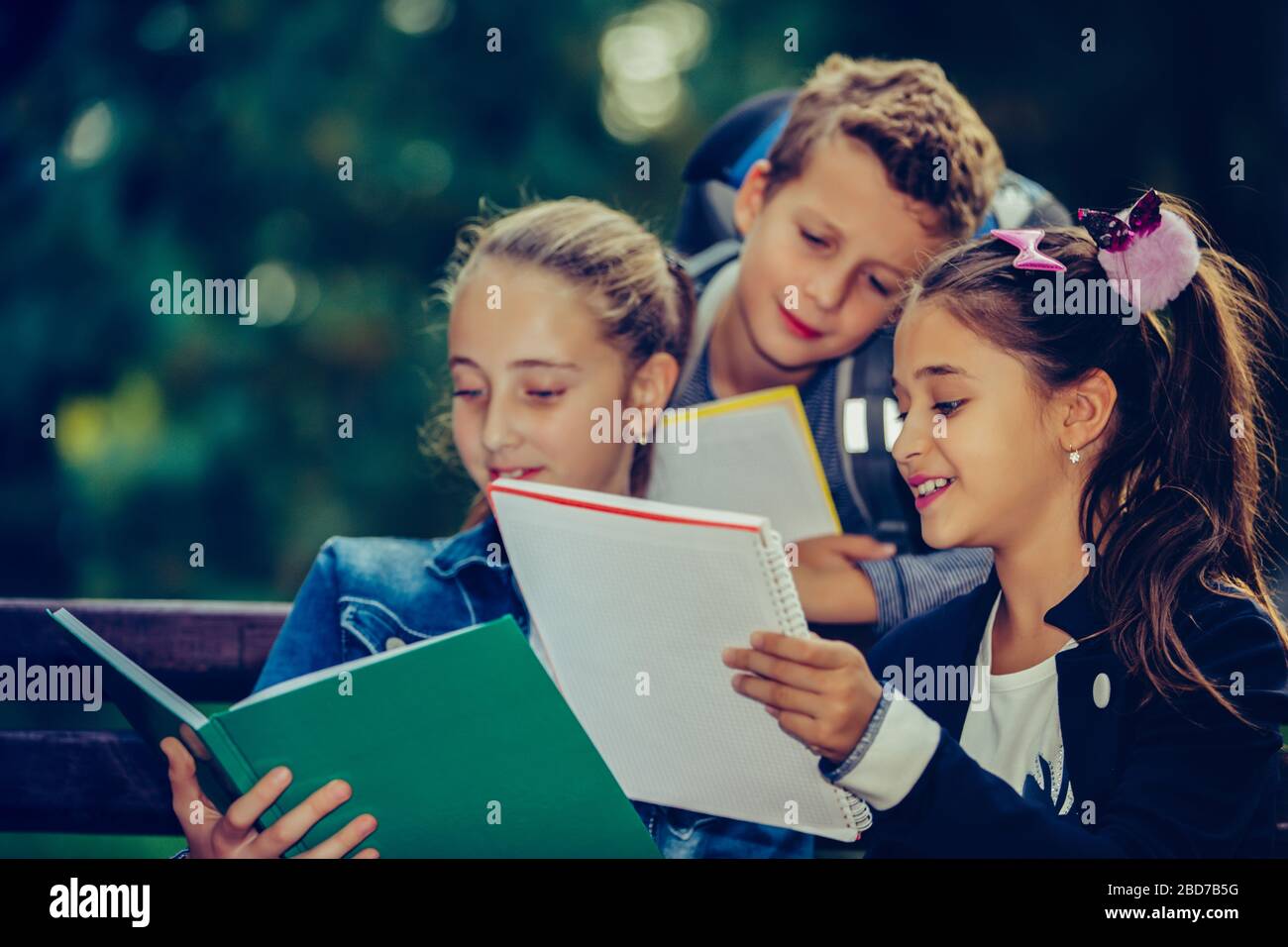 Back to school. Children with backpacks are having fun, talking ...