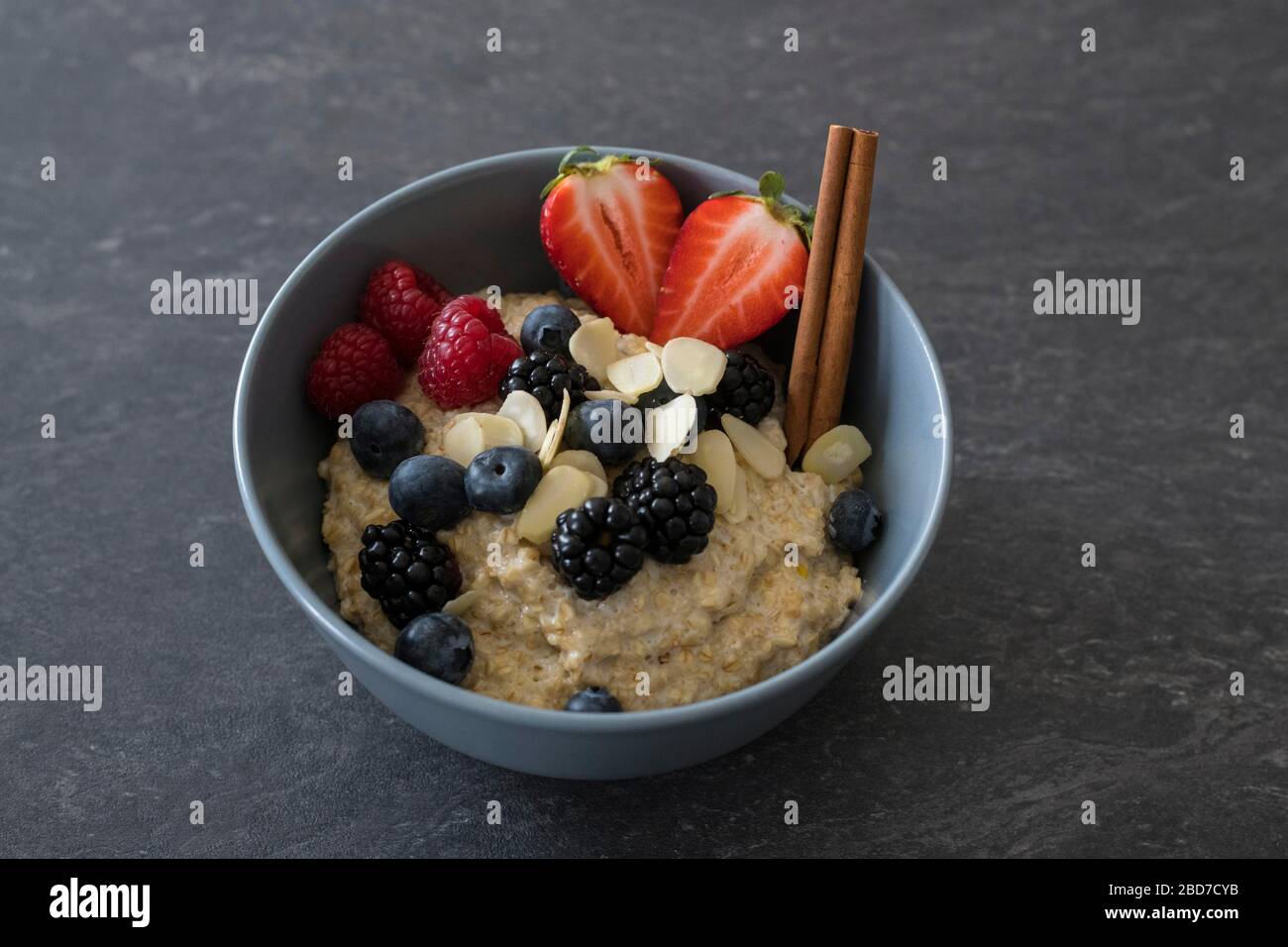Porridge or porridge in bowl with fruits, healthy breakfast, Germany ...