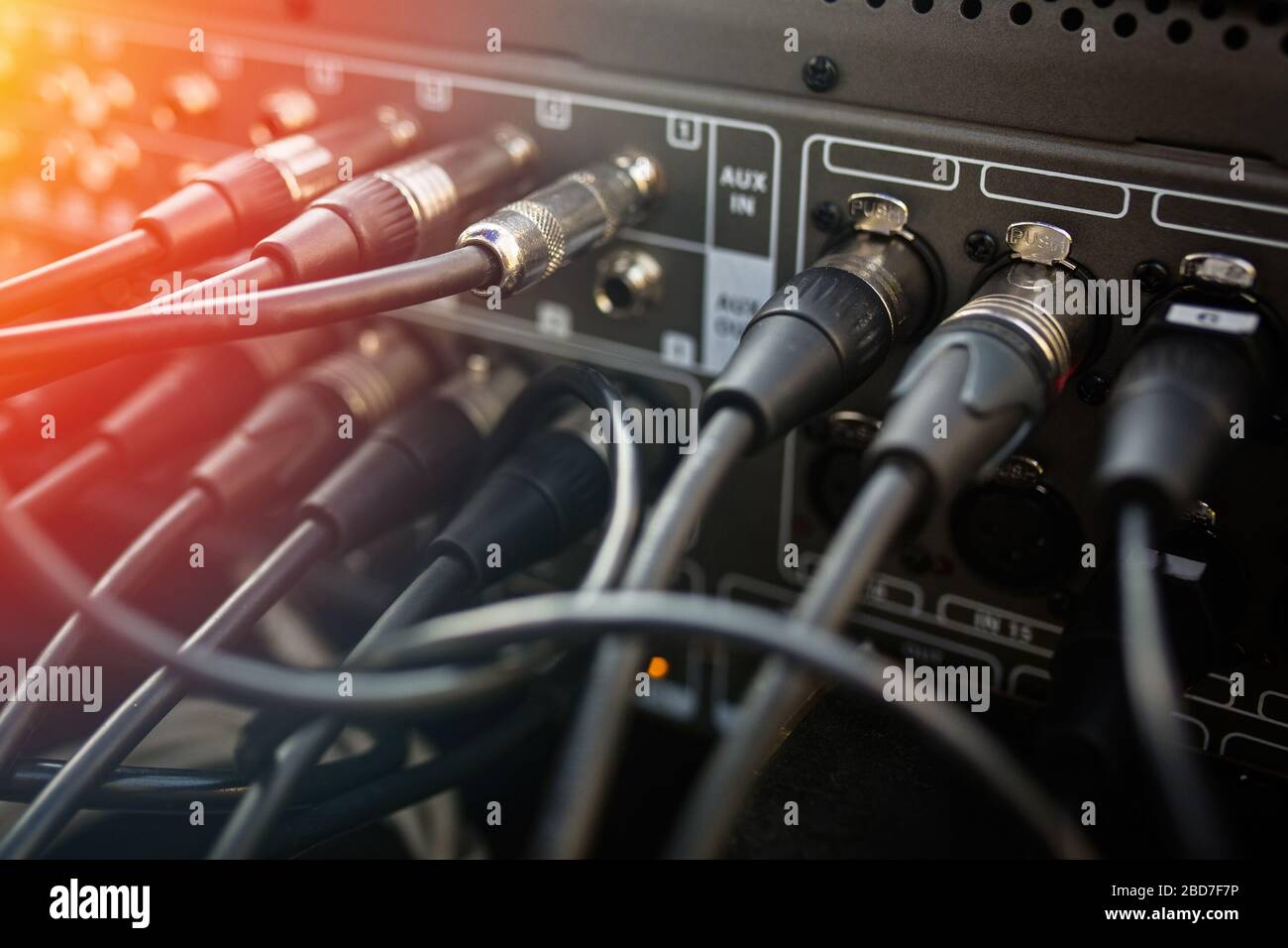Close up audio jacks cable plugged into mixer console. XLR audio cable ...