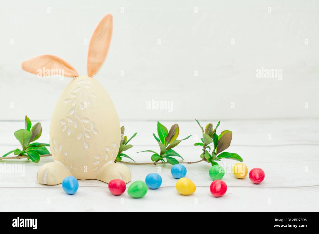 Funny Easter bunny with chocolate Easter eggs Stock Photo - Alamy