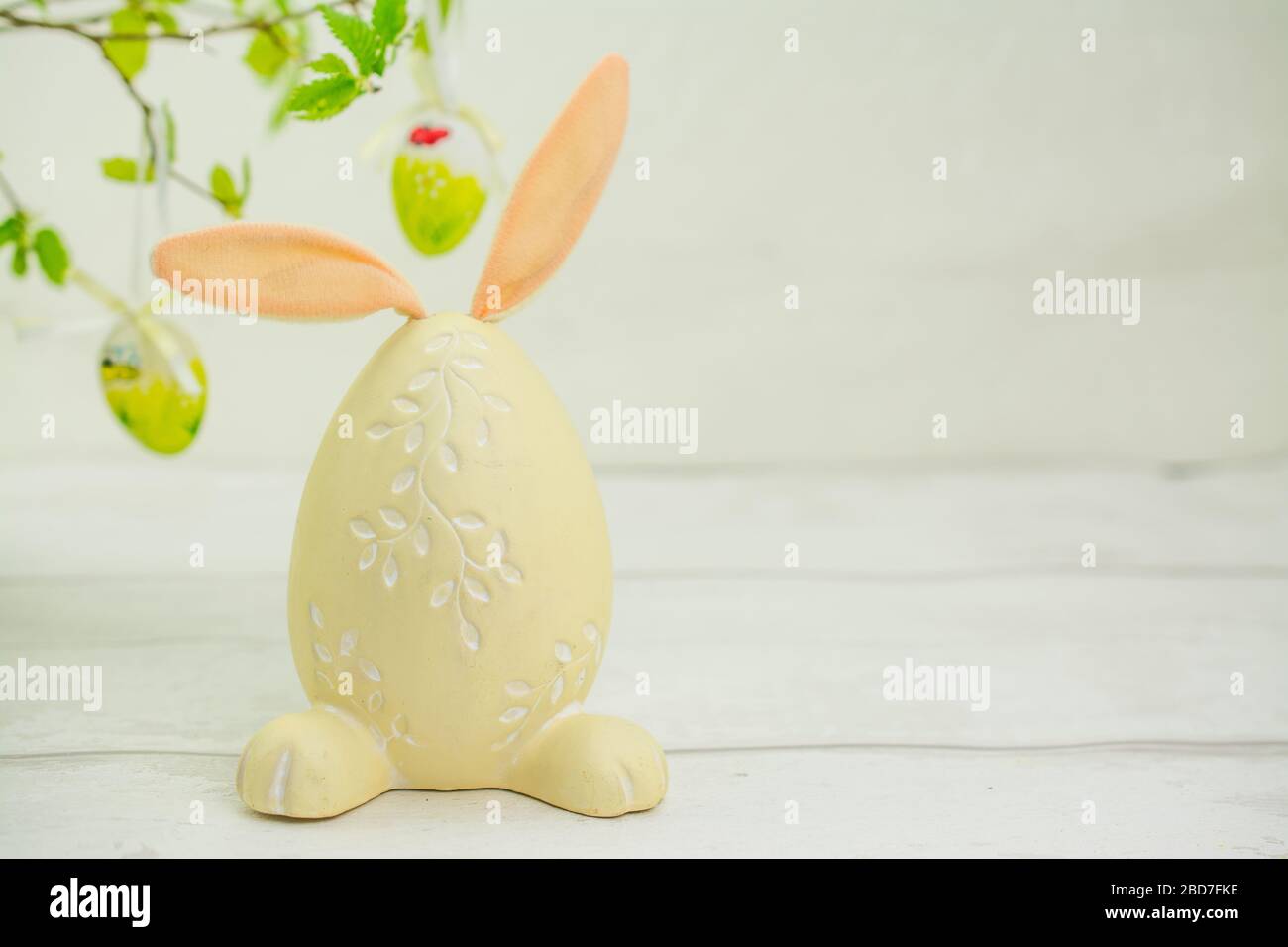 Funny Easter bunny with chocolate Easter eggs Stock Photo - Alamy