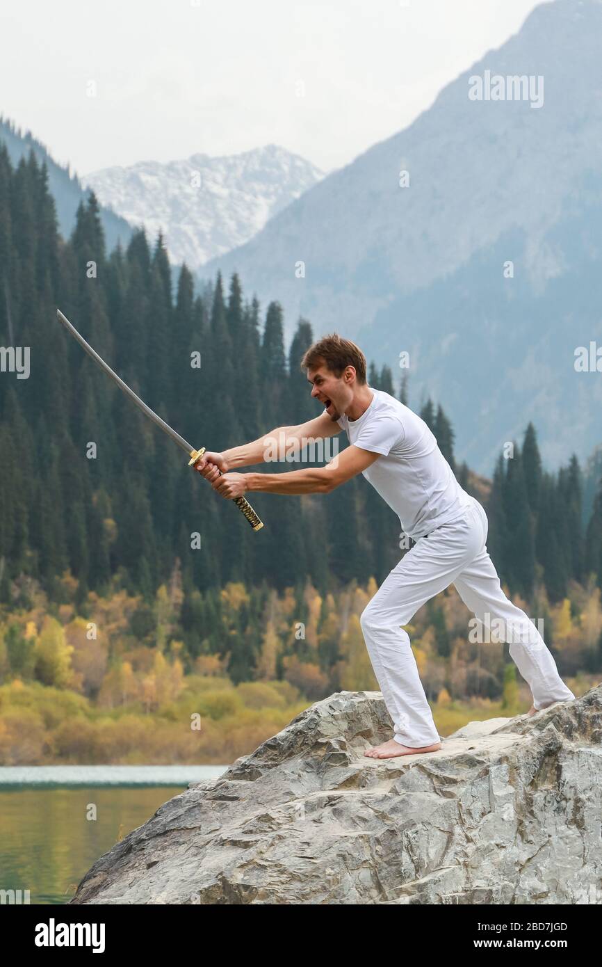 A man with a sword goes on the attack on the enemy. The emotional ...