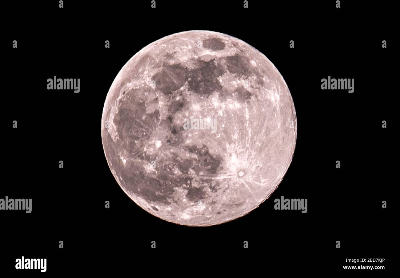 Pink Supermoon viewed from Bournemouth. Credit: Charlie Raven/Alamy ...
