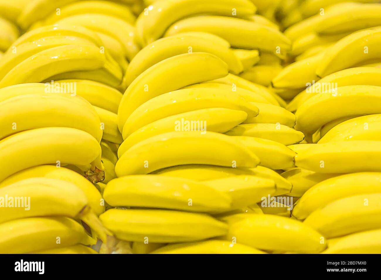 Fresh clear banana sunny yellow background texture Stock Photo - Alamy