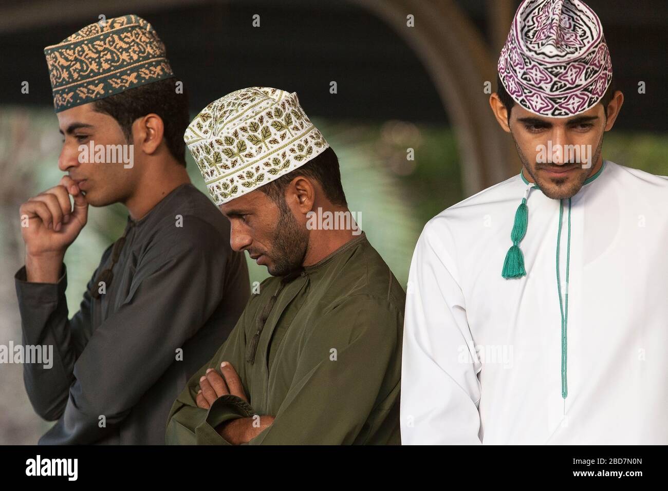 Omani men and boys appraise and haggle for livestock at the friday ...