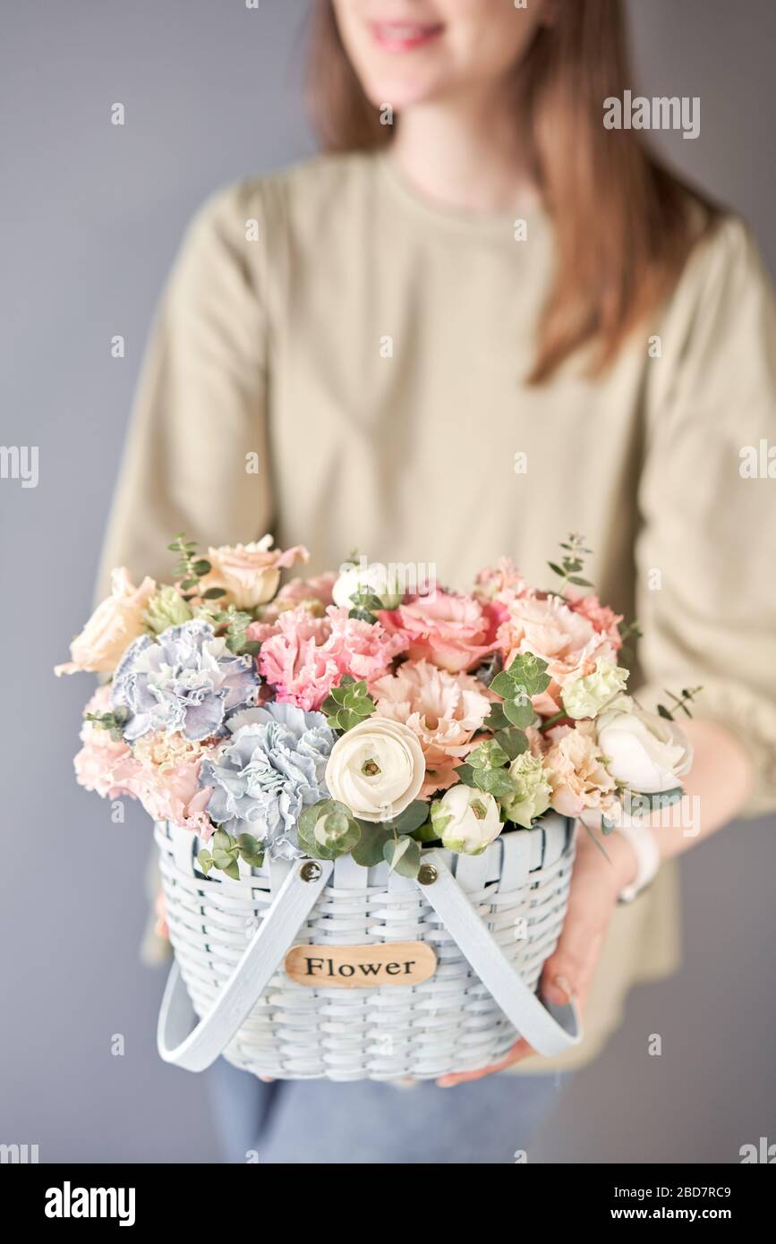 Small flower shop and Flowers delivery. Flower arrangement in Wicker ...