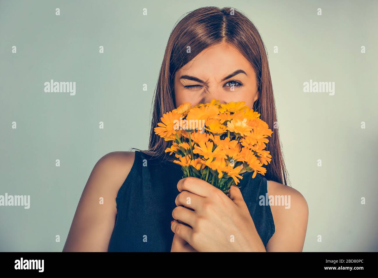 Beautiful smiling girl, woman holding bouquet of marigold, calendula ...