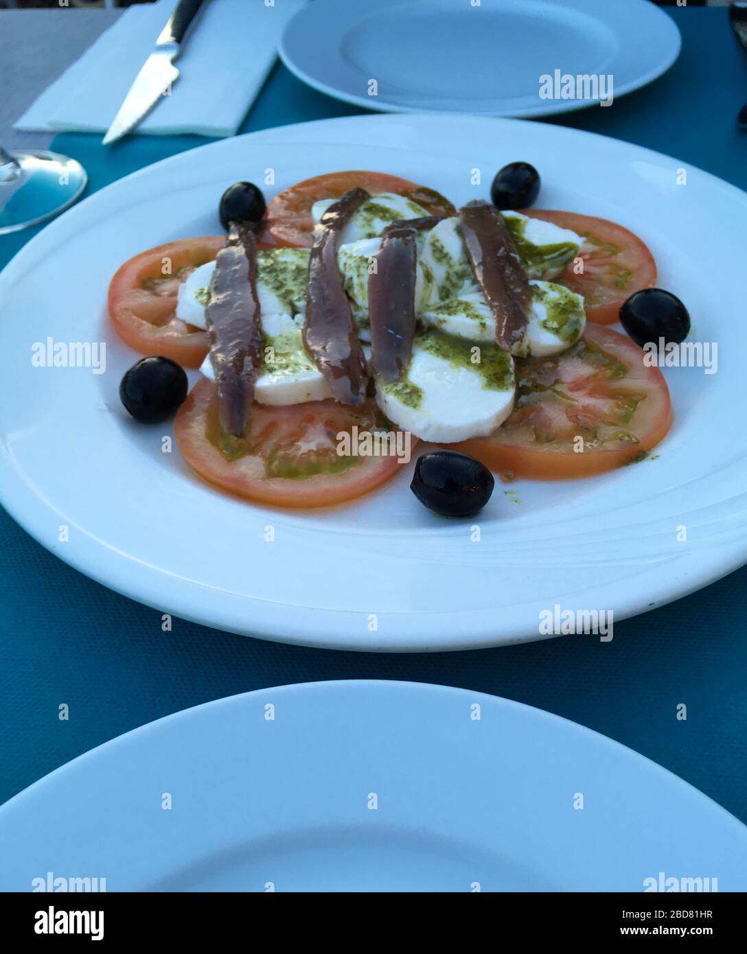 mediterranean starter - sliced tomato, mozzarella, olives, anchovy ...