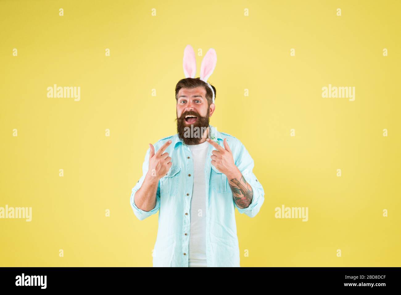 Easter advertising. Happy mister rabbit pointing up. Bearded man ...