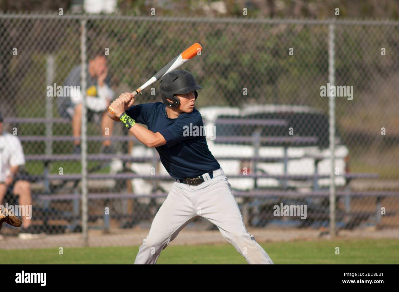 Teen baseball player ready to swing in the batters box Stock Photo - Alamy