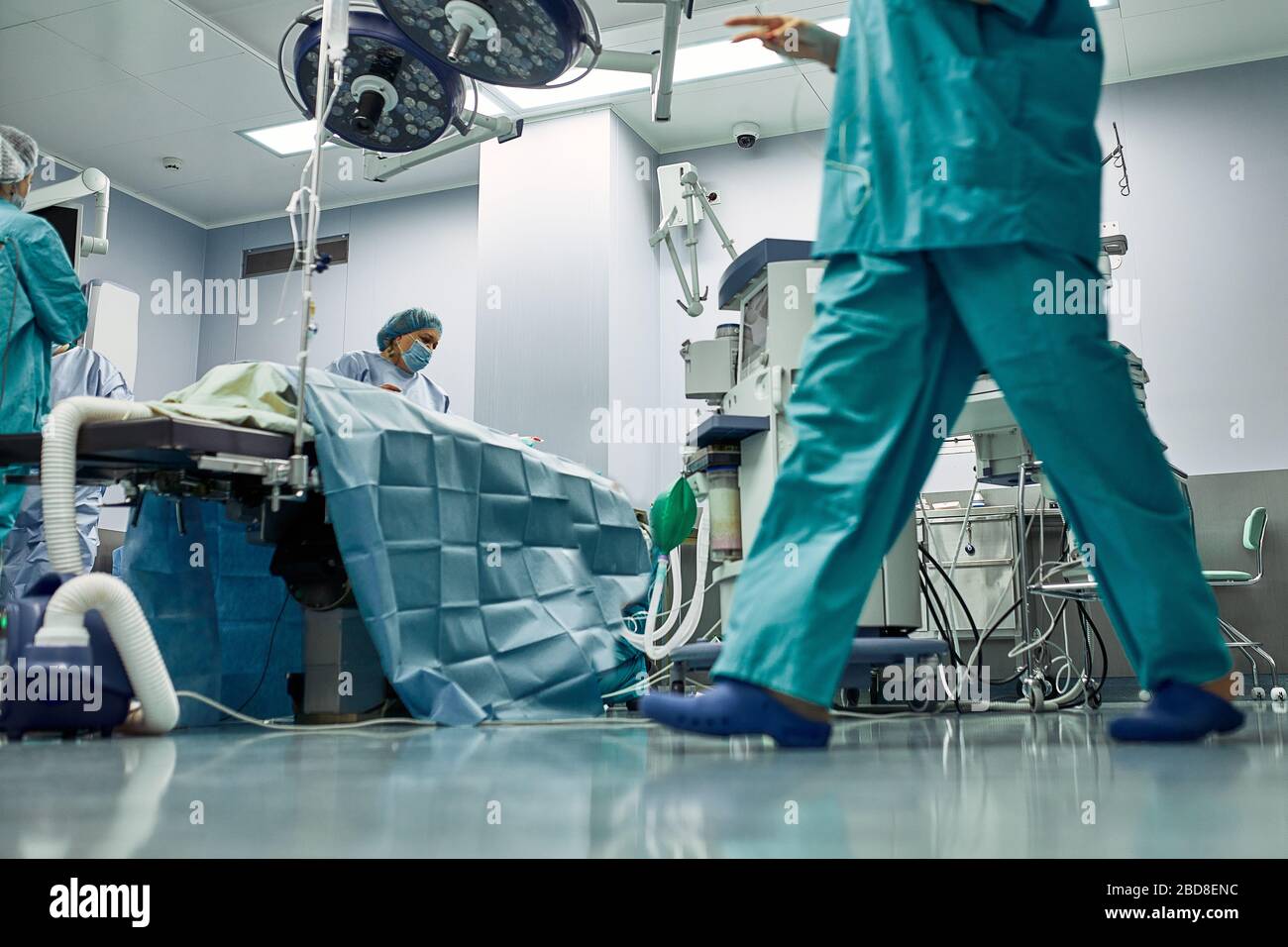The medical team is preparing the operating room for a complex ...