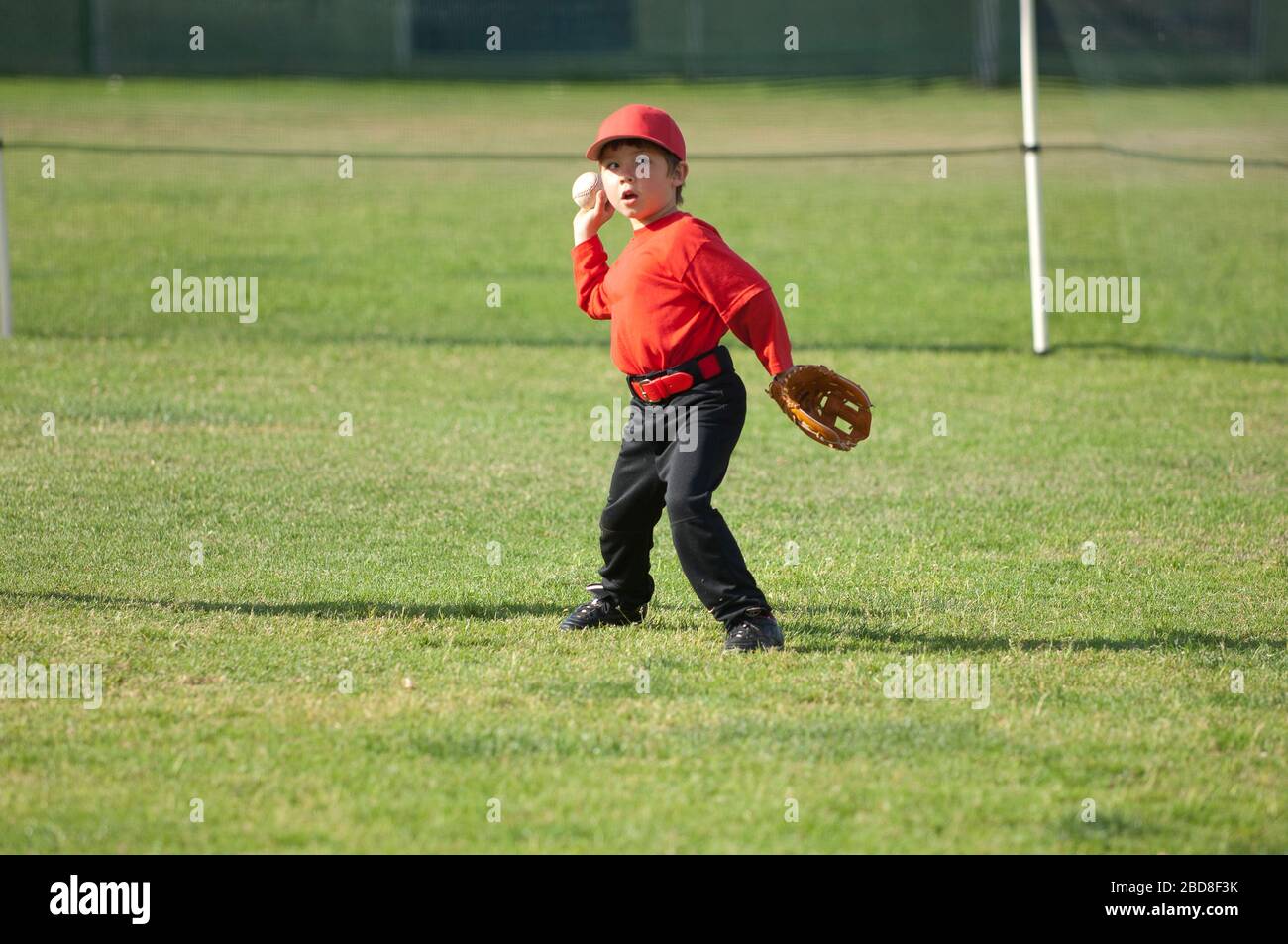 Boy throwing a ball hi-res stock photography and images - Alamy