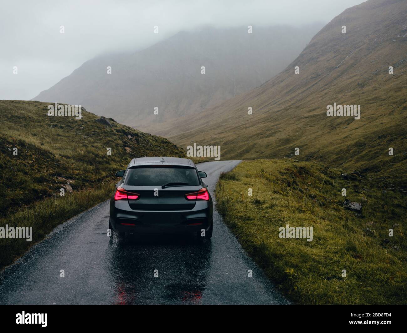 Car driving on road through Glen Etive Stock Photo - Alamy