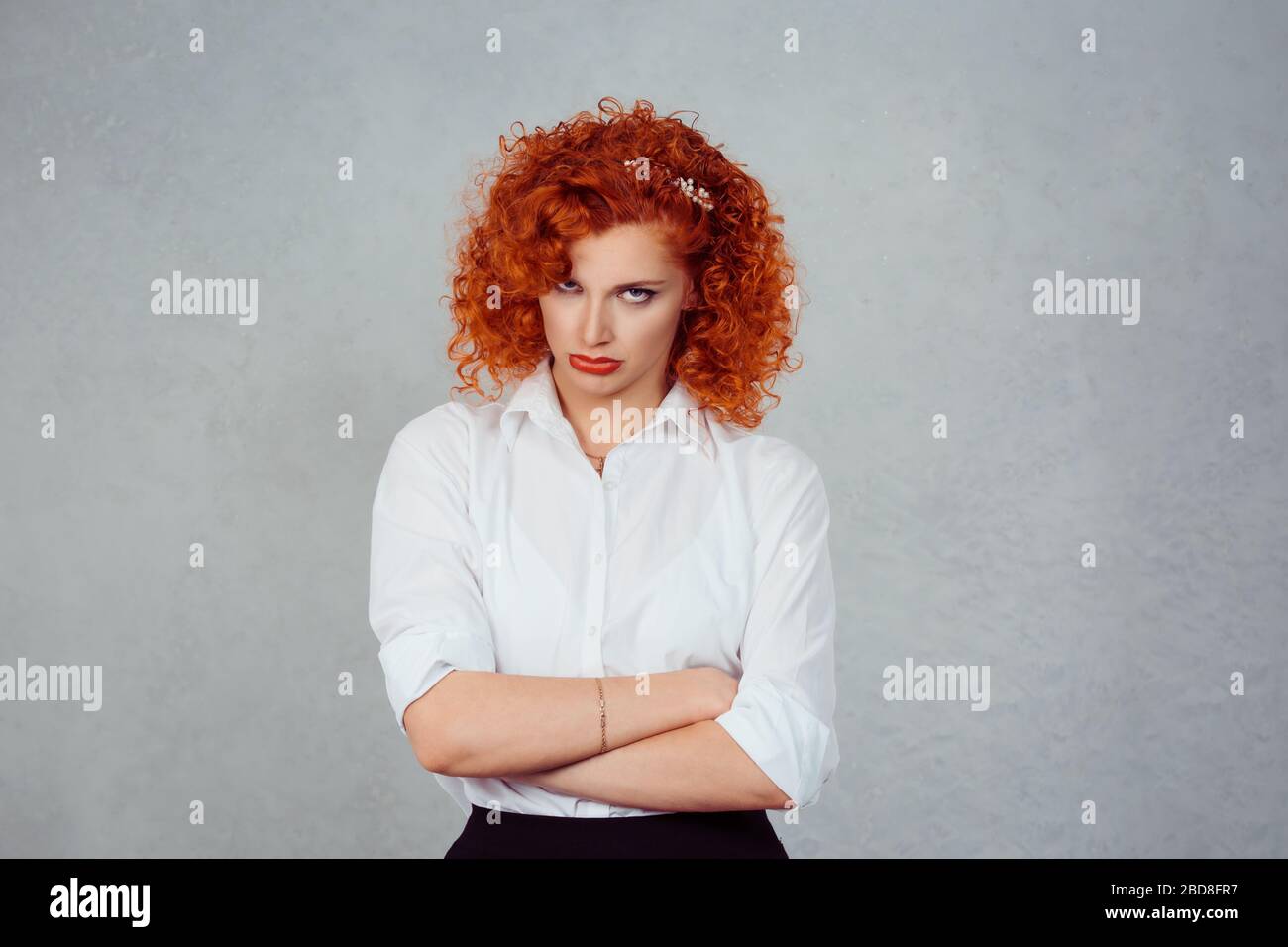 Sad woman. Headshot of young business lady red head girl ginger hair ...
