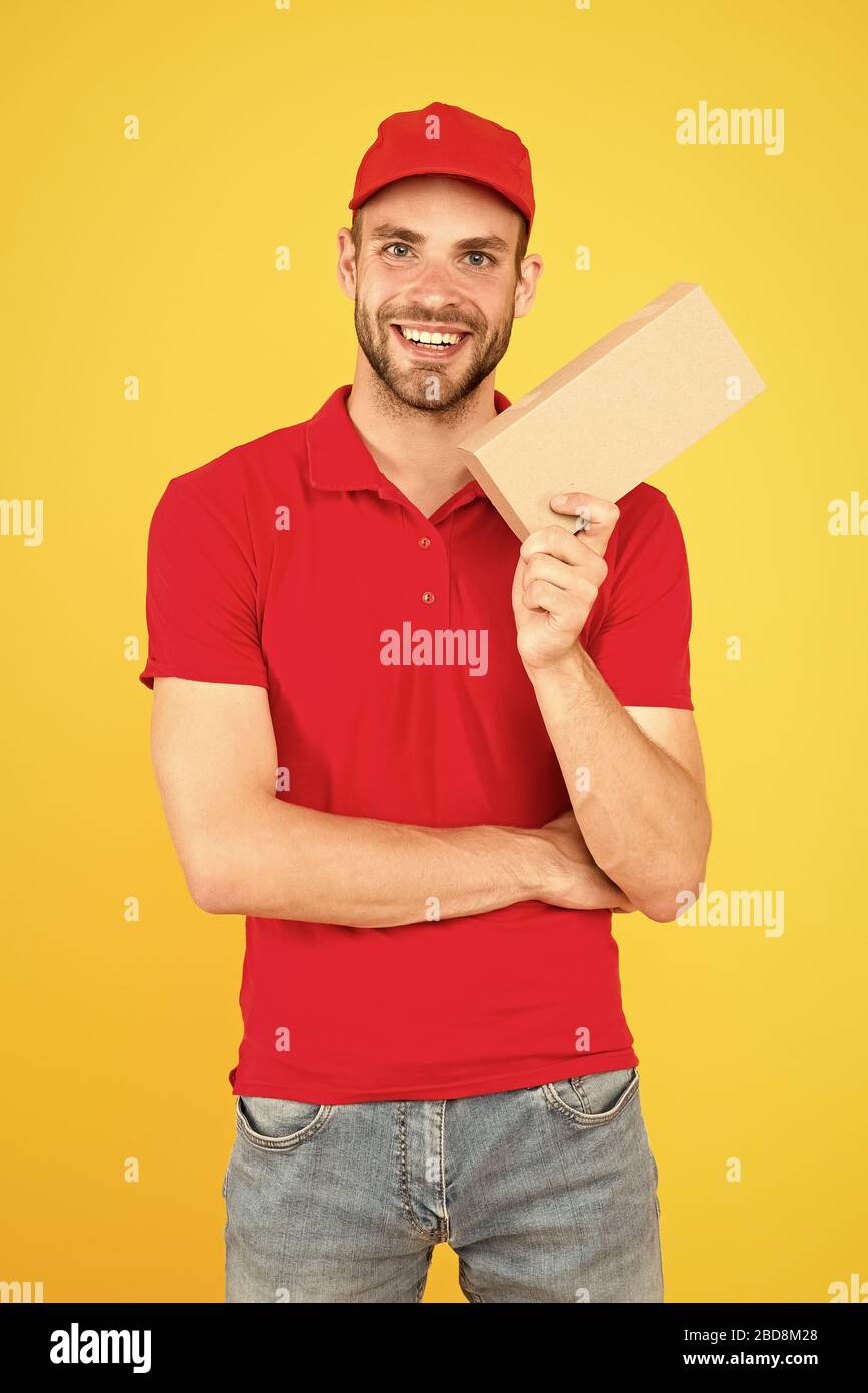 Postman delivery worker. Man red cap yellow background. Delivering ...