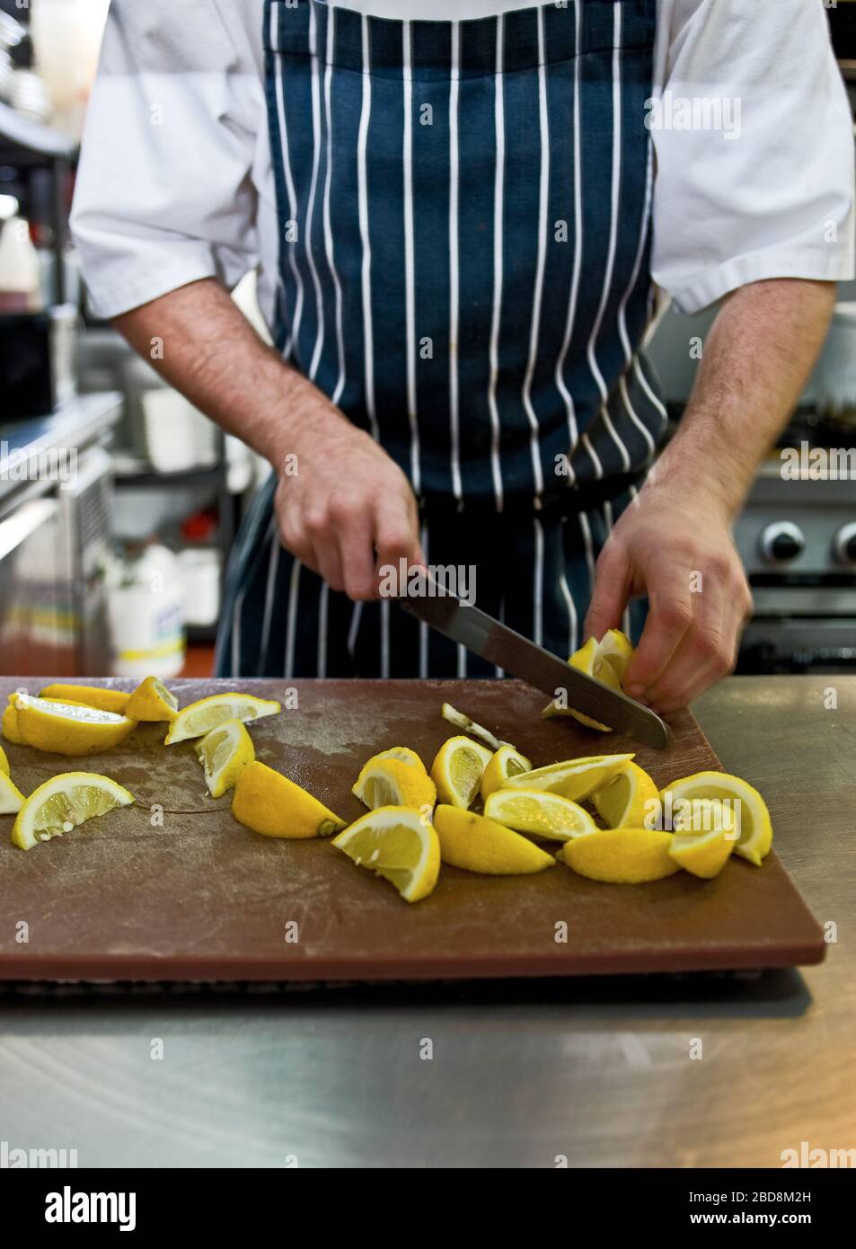 chef chopping fresh lemon at restaurant in the UK Stock Photo - Alamy