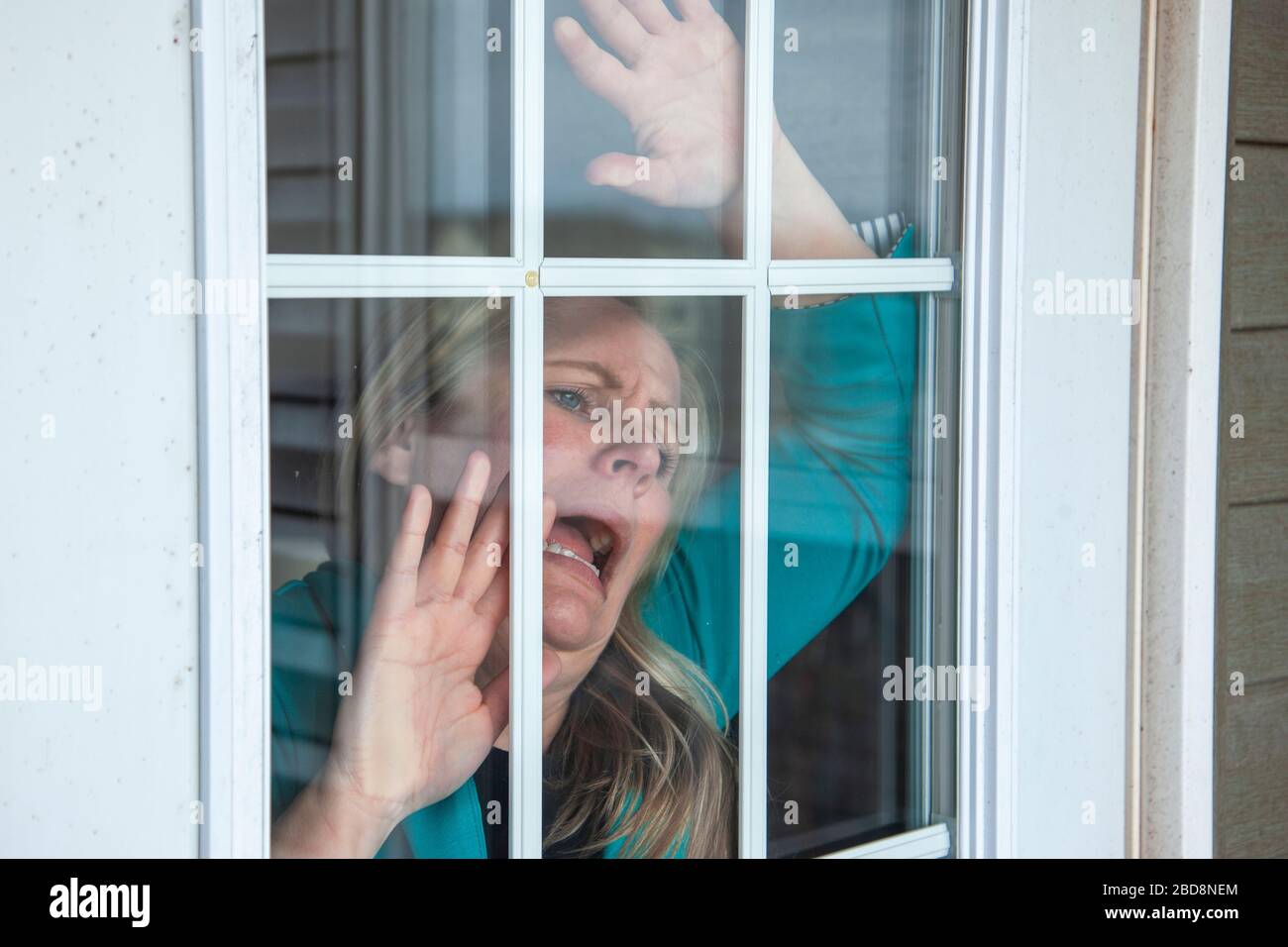 Hands against glass door hi-res stock photography and images - Alamy