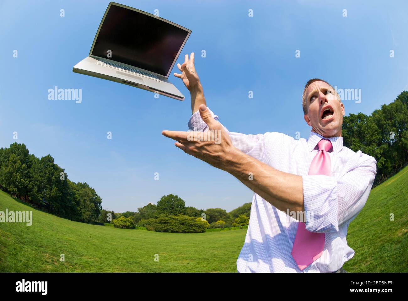 Panicked businessman running away from a flying laptop computer Stock ...