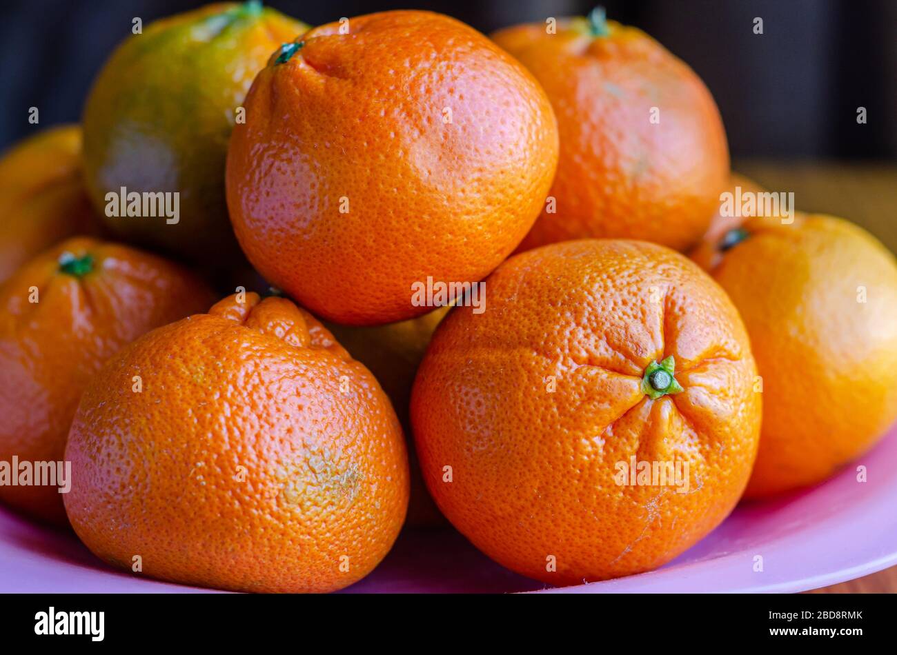 Fresh mandarin orange fruits on a plate in a still life shot Stock ...