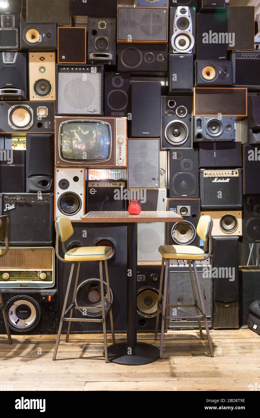 Inside Turtle Bay Ealing Broadway - table and chairs against a wall of ...