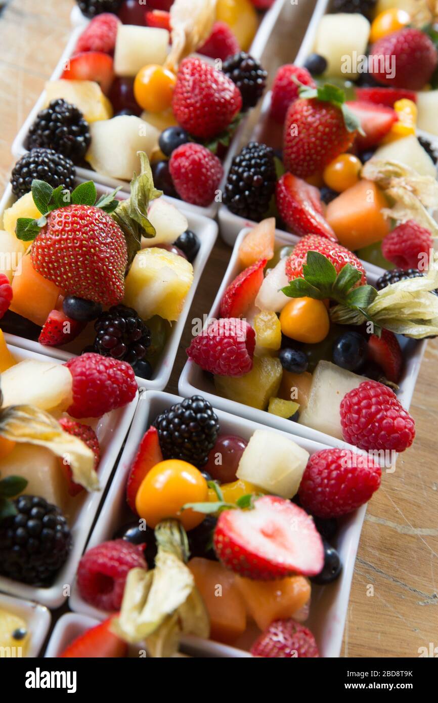 Bowls of strawberries and raspberries at a party Stock Photo - Alamy