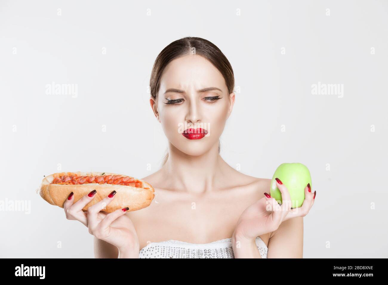 I do not like healthy I love unhealthy food. Woman holding hotdog ...