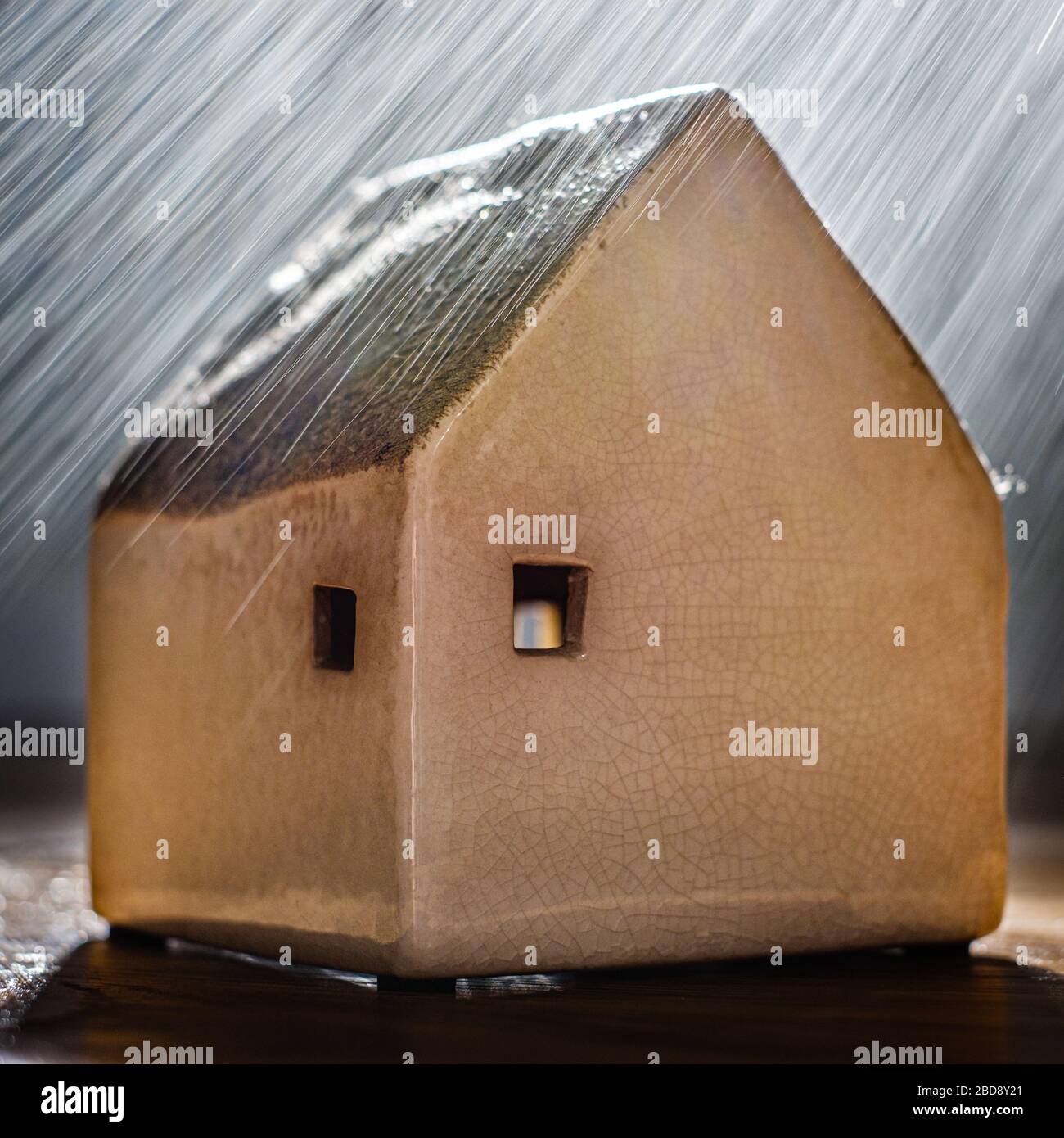 Little house in the rain Stock Photo - Alamy