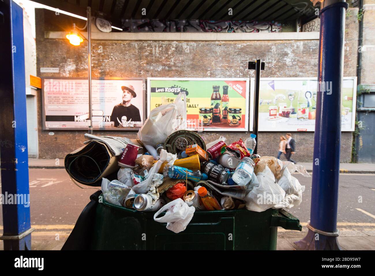 Full waste bin overflowed with rubbish Stock Photo - Alamy