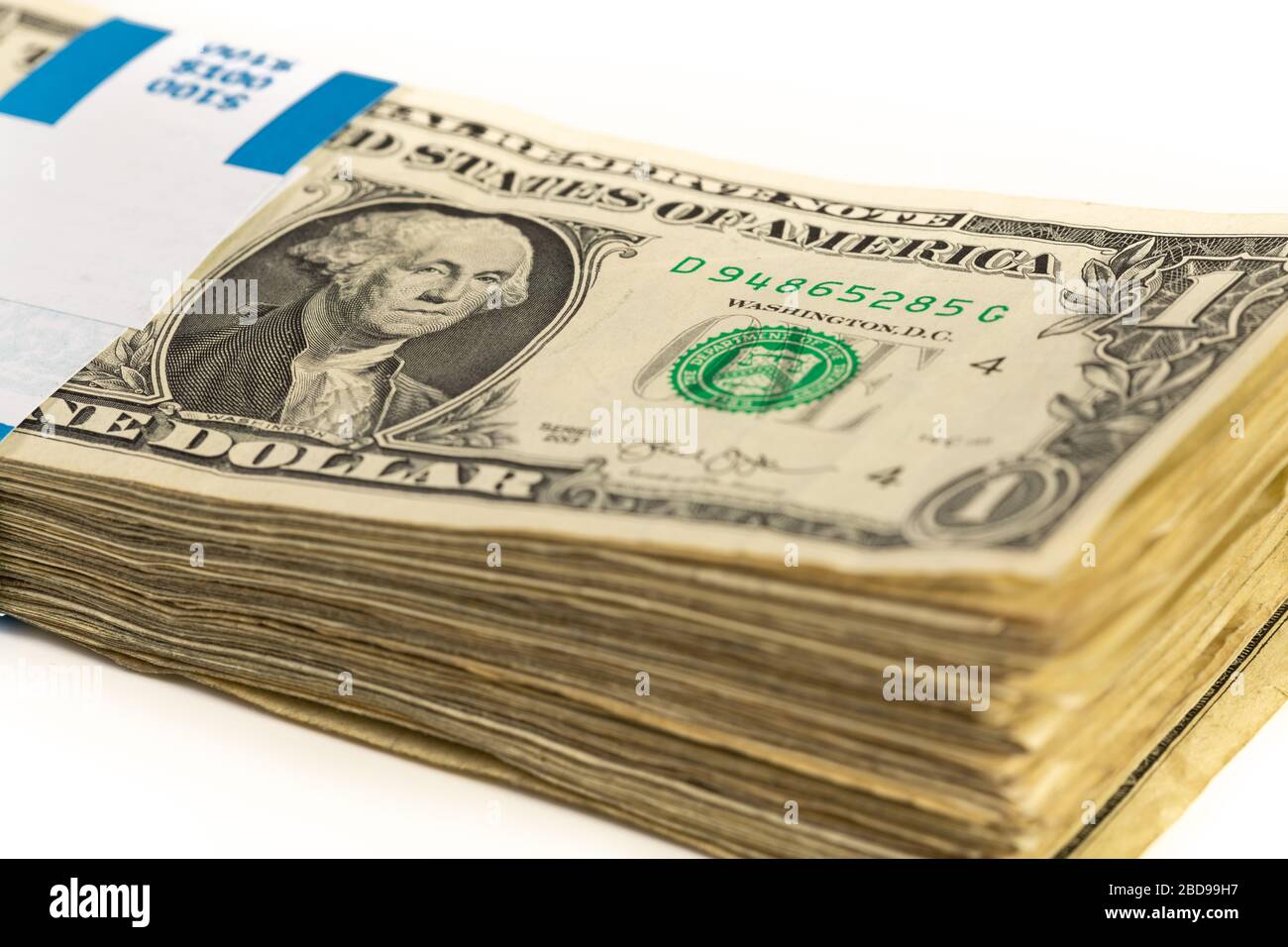 Stack of American dollar bills on top isolated on a white background ...