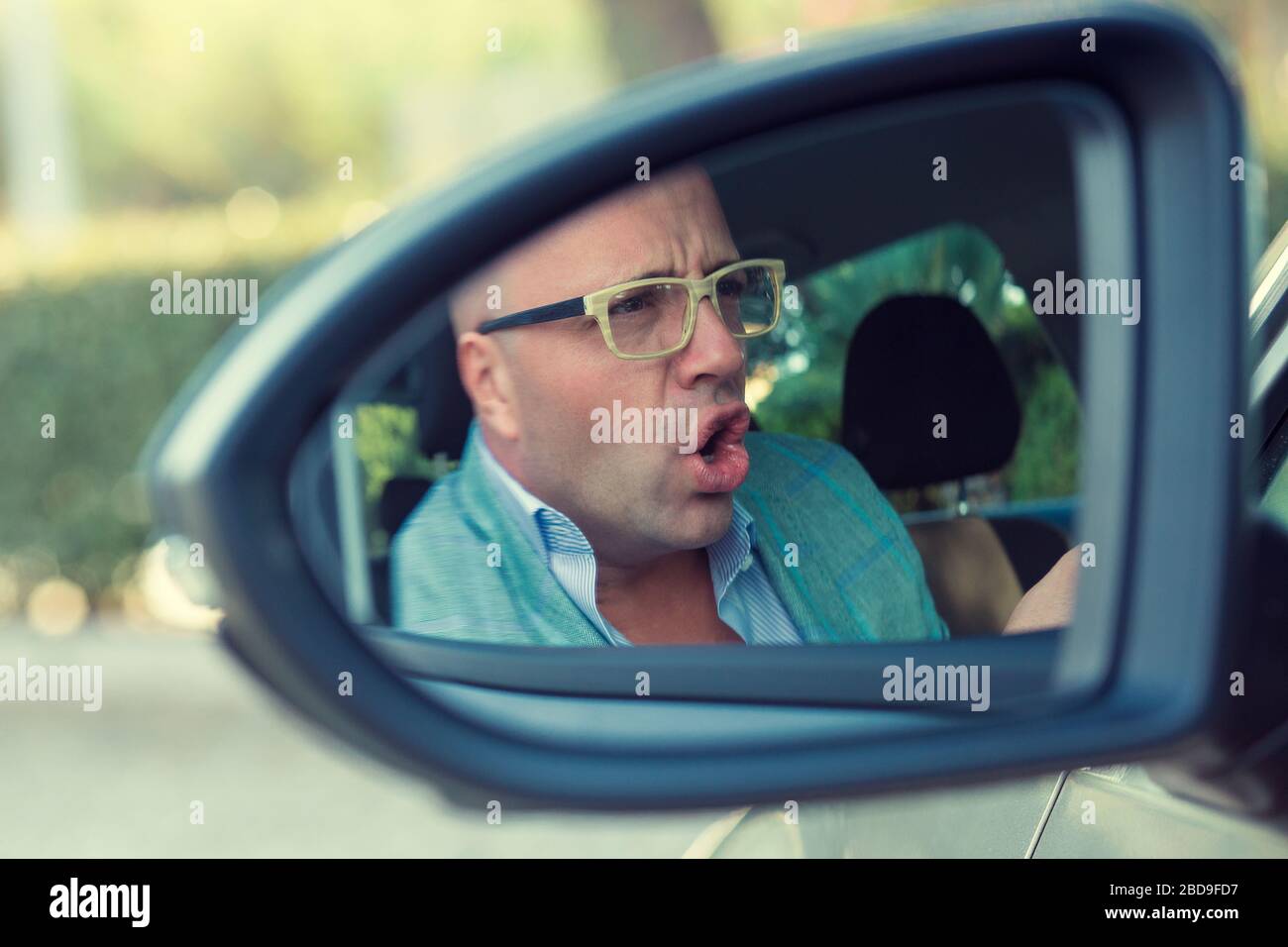 Handsome business man about to make an accident. Looking shocked Stock ...