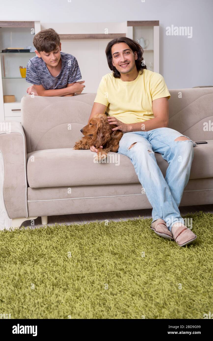 Young father and son with cocker spaniel dog Stock Photo - Alamy