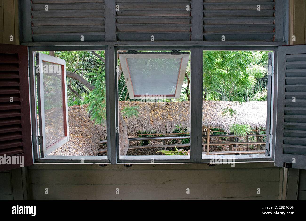 Thatched roof construction as seen from a shuttered window in the ...