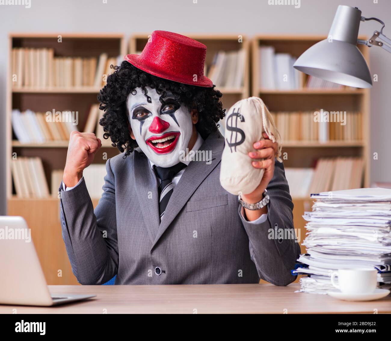 The clown businessman working in the office Stock Photo - Alamy