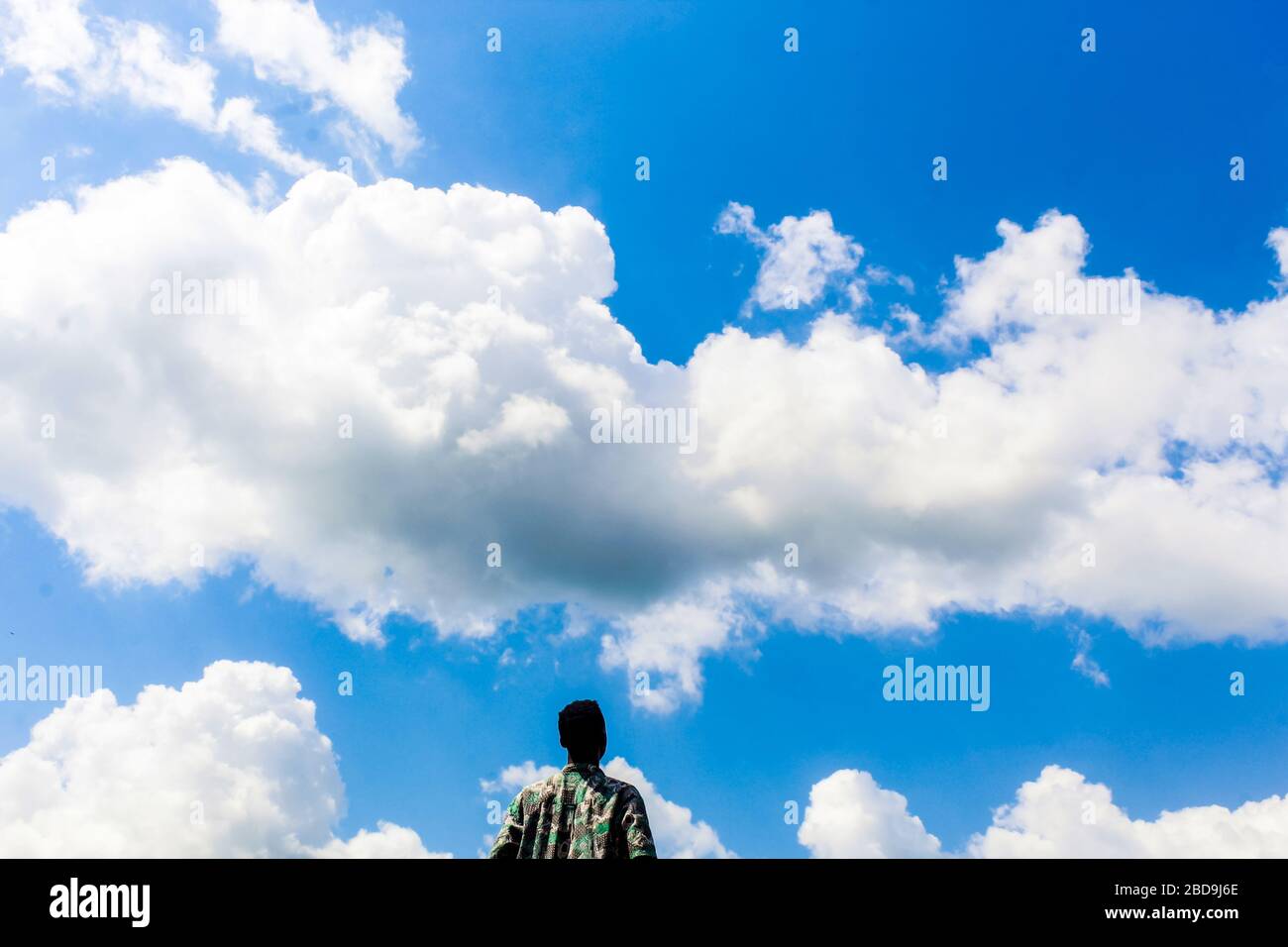 One Young Adult man Facing the Cloud and talking to God Stock Photo - Alamy