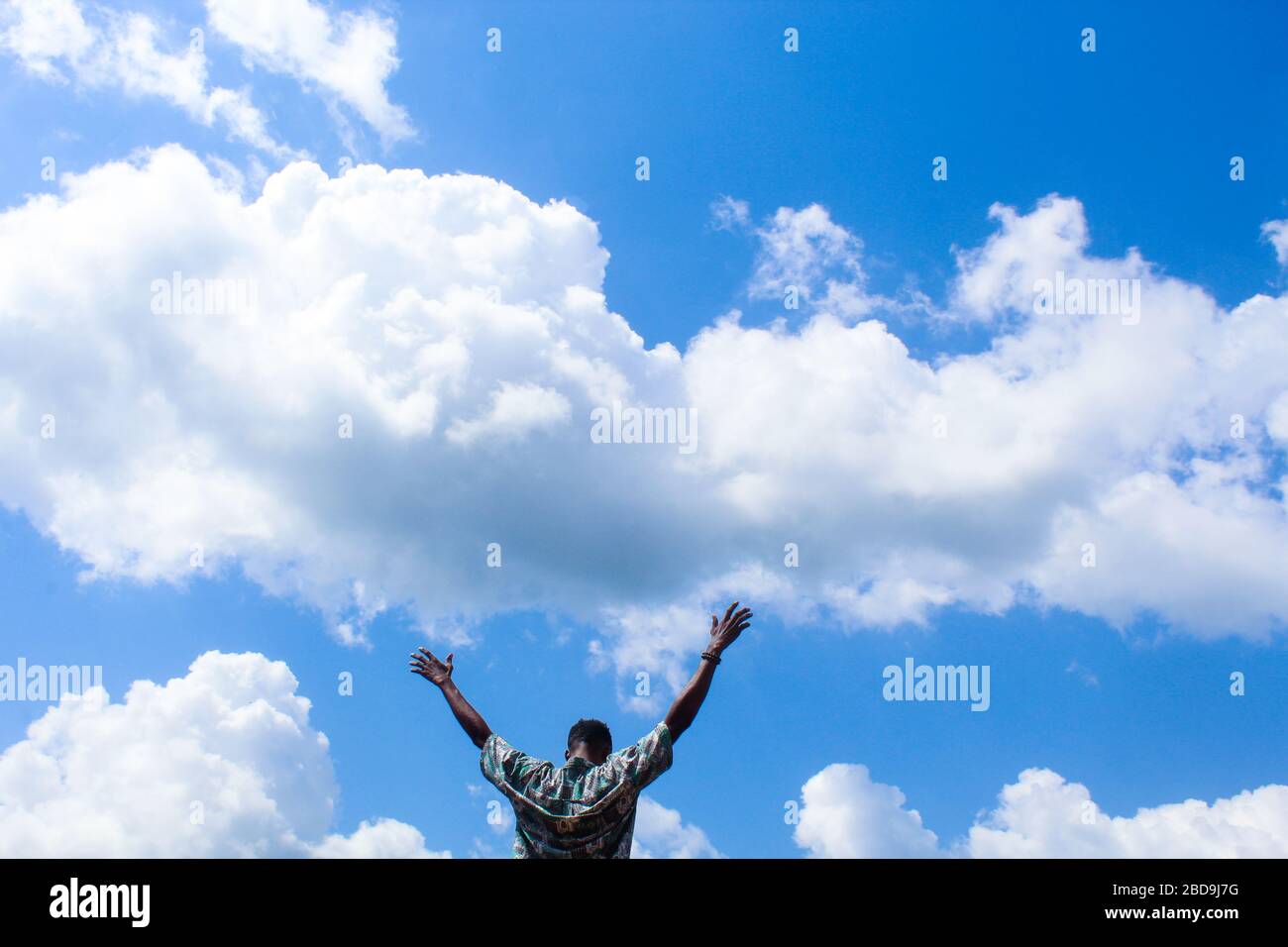 One Young Adult man Facing the Cloud and talking to God Stock Photo - Alamy
