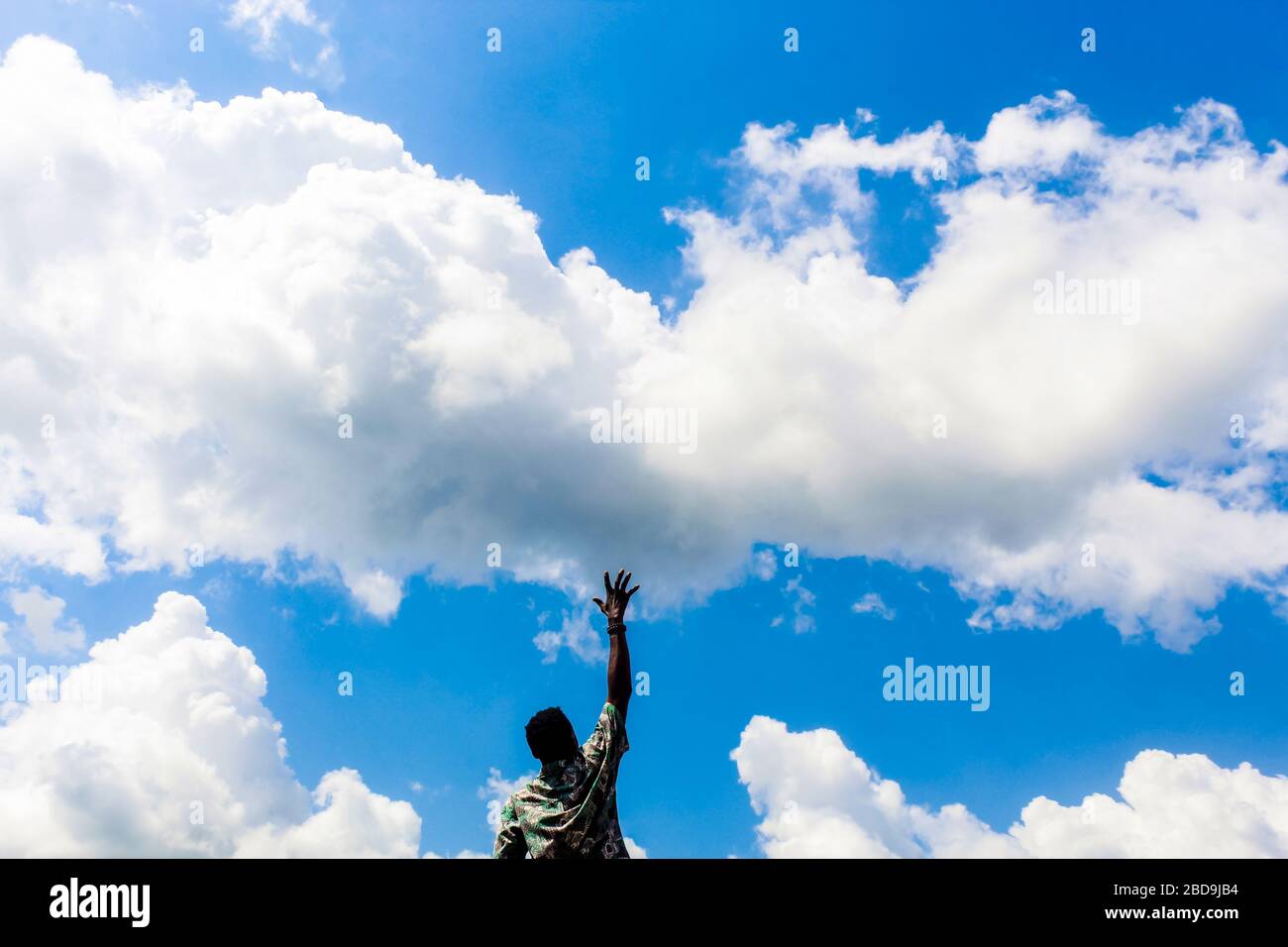 One Young Adult man Facing the Cloud and talking to God Stock Photo - Alamy