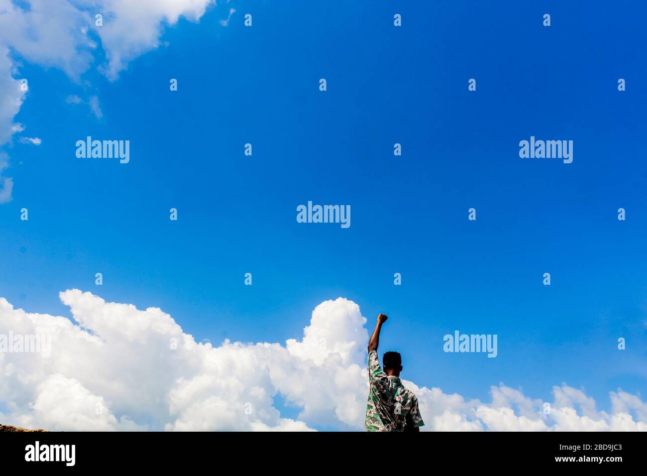 One Young Adult man Facing the Cloud and talking to God Stock Photo - Alamy