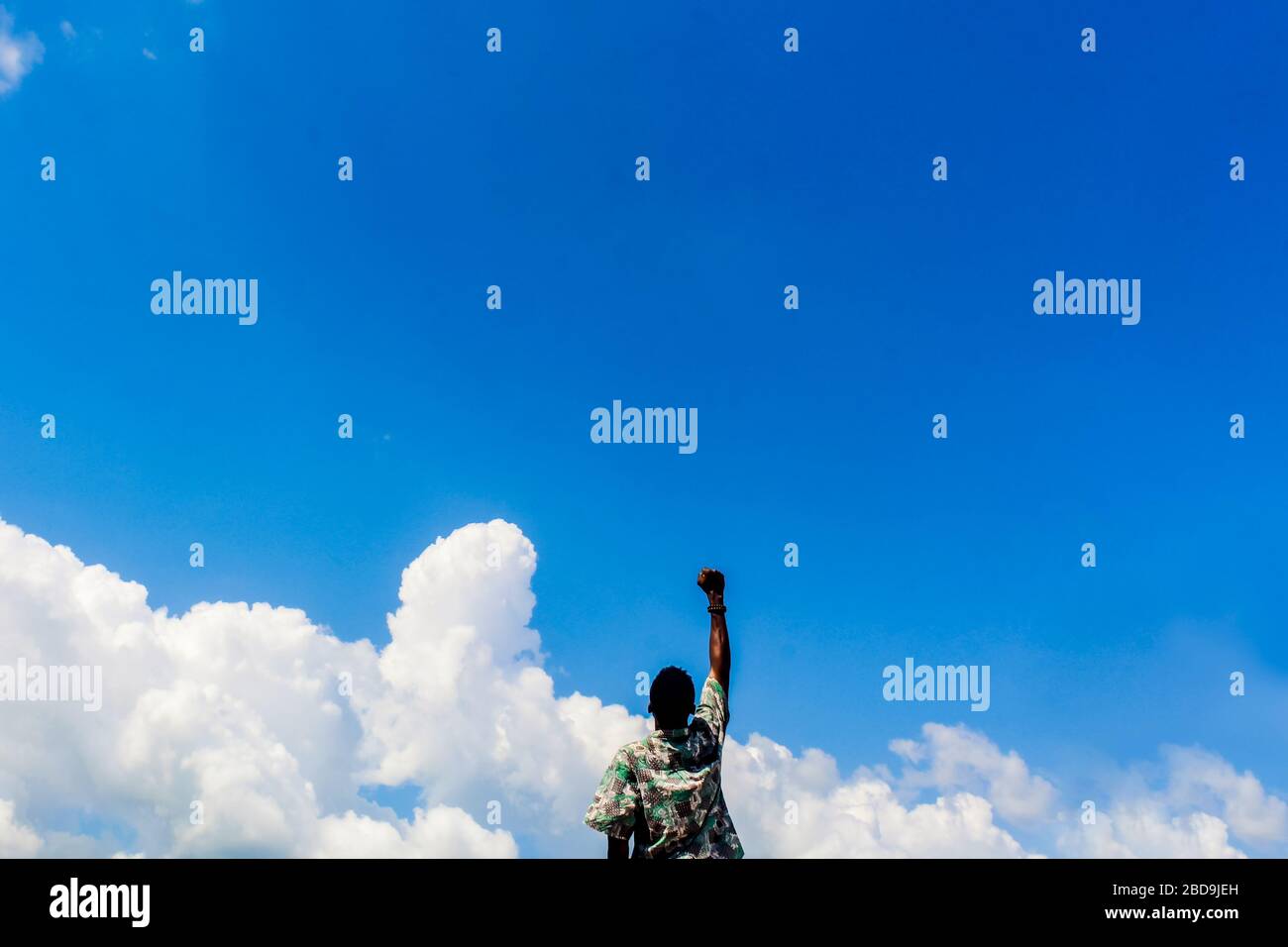 One Young Adult man Facing the Cloud and talking to God Stock Photo - Alamy