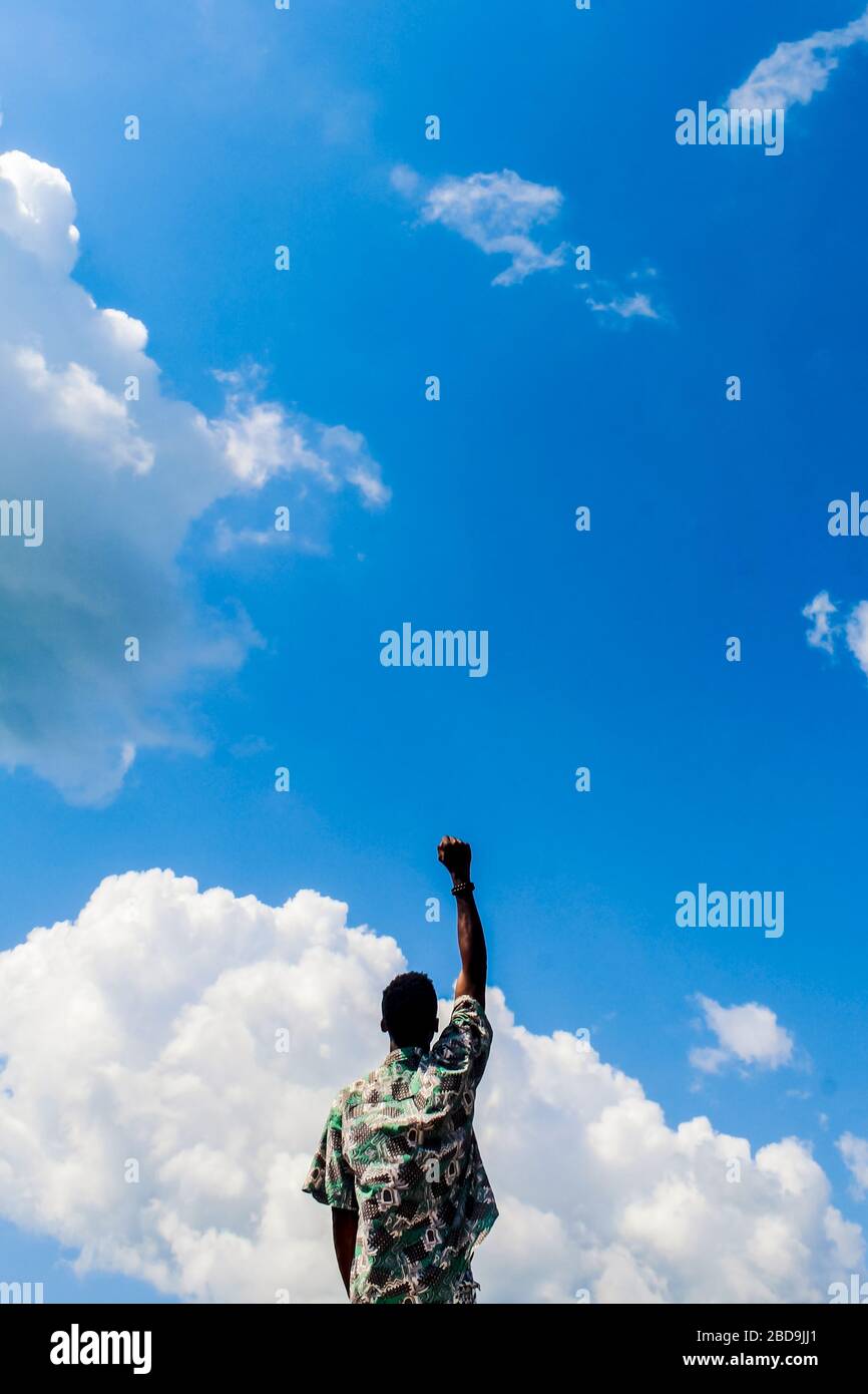 One Young Adult man Facing the Cloud and talking to God Stock Photo - Alamy