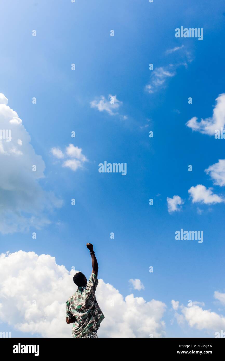 One Young Adult man Facing the Cloud and talking to God Stock Photo - Alamy