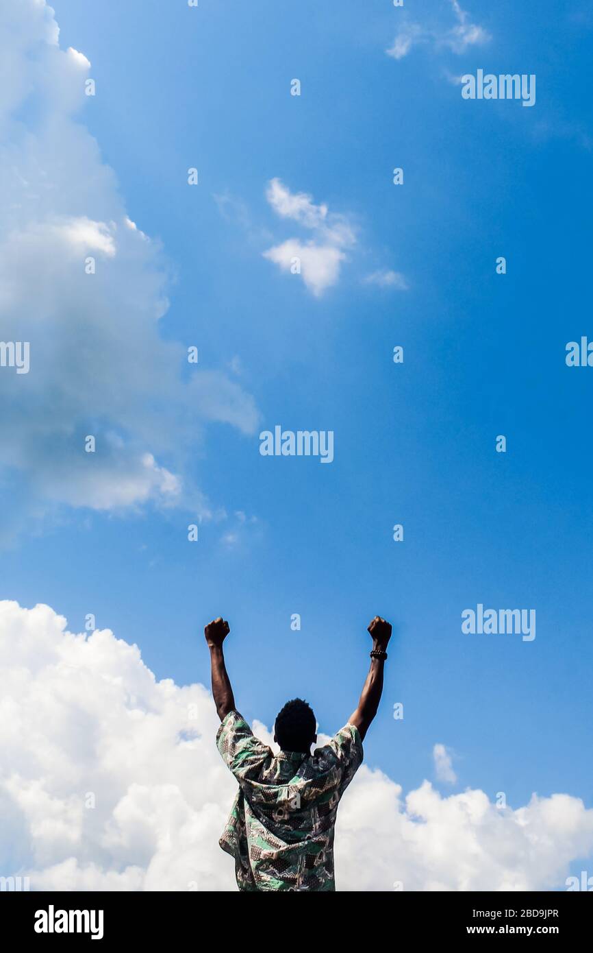 One Young Adult man Facing the Cloud and talking to God Stock Photo - Alamy