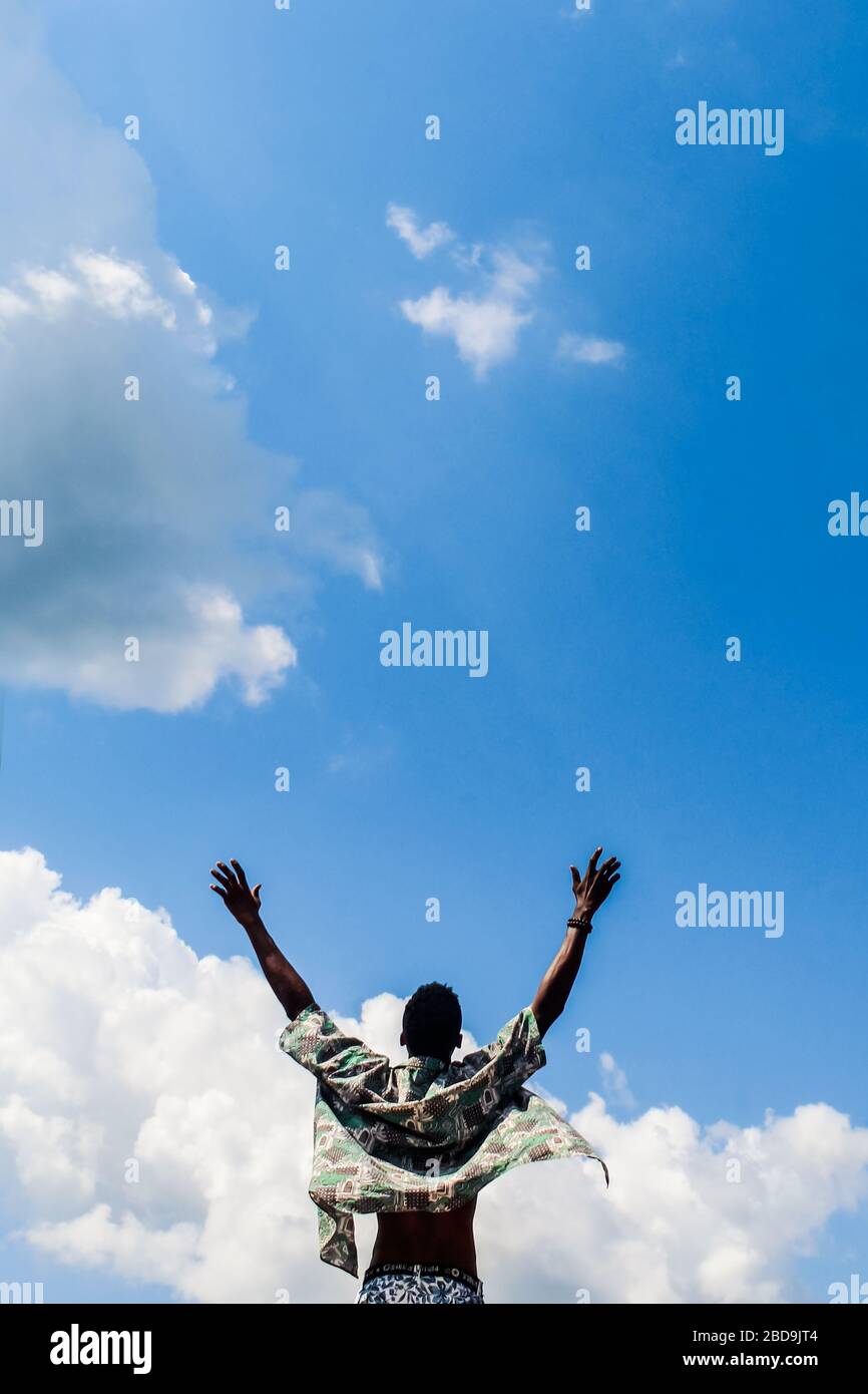One Young Adult man Facing the Cloud and talking to God Stock Photo - Alamy