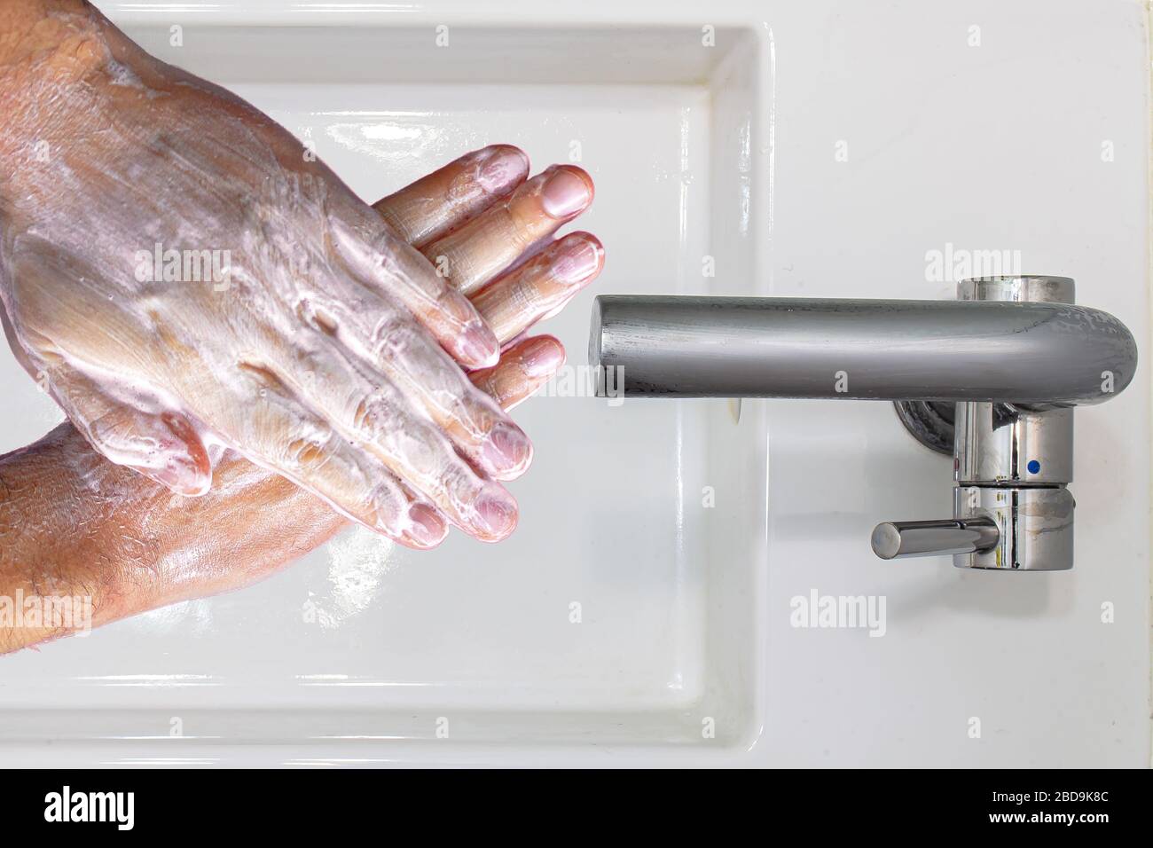 Top view of a person washing hands with soap on a wash basin Stock ...