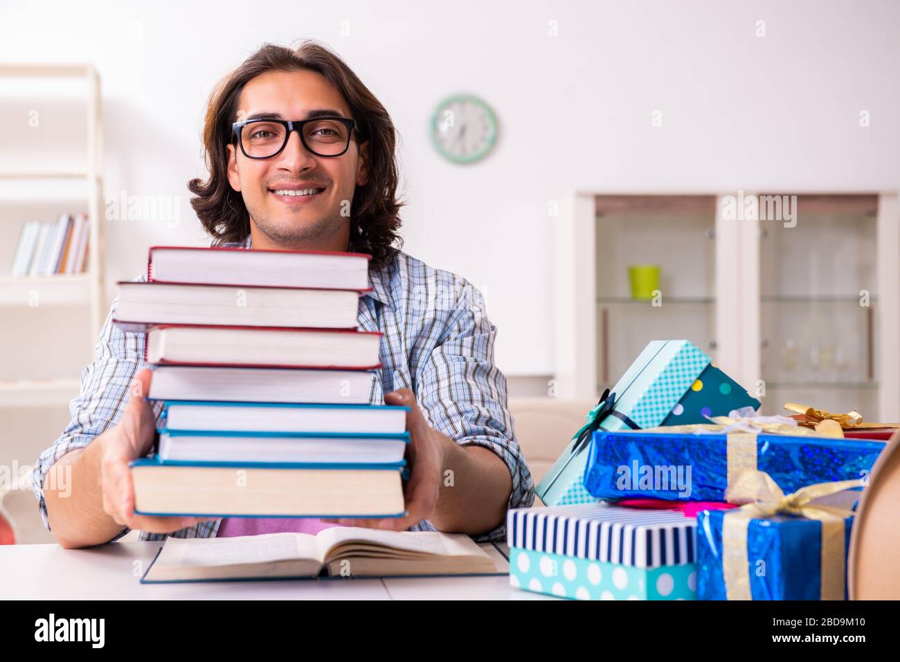 The young male student preparing for exams during christmas Stock Photo ...