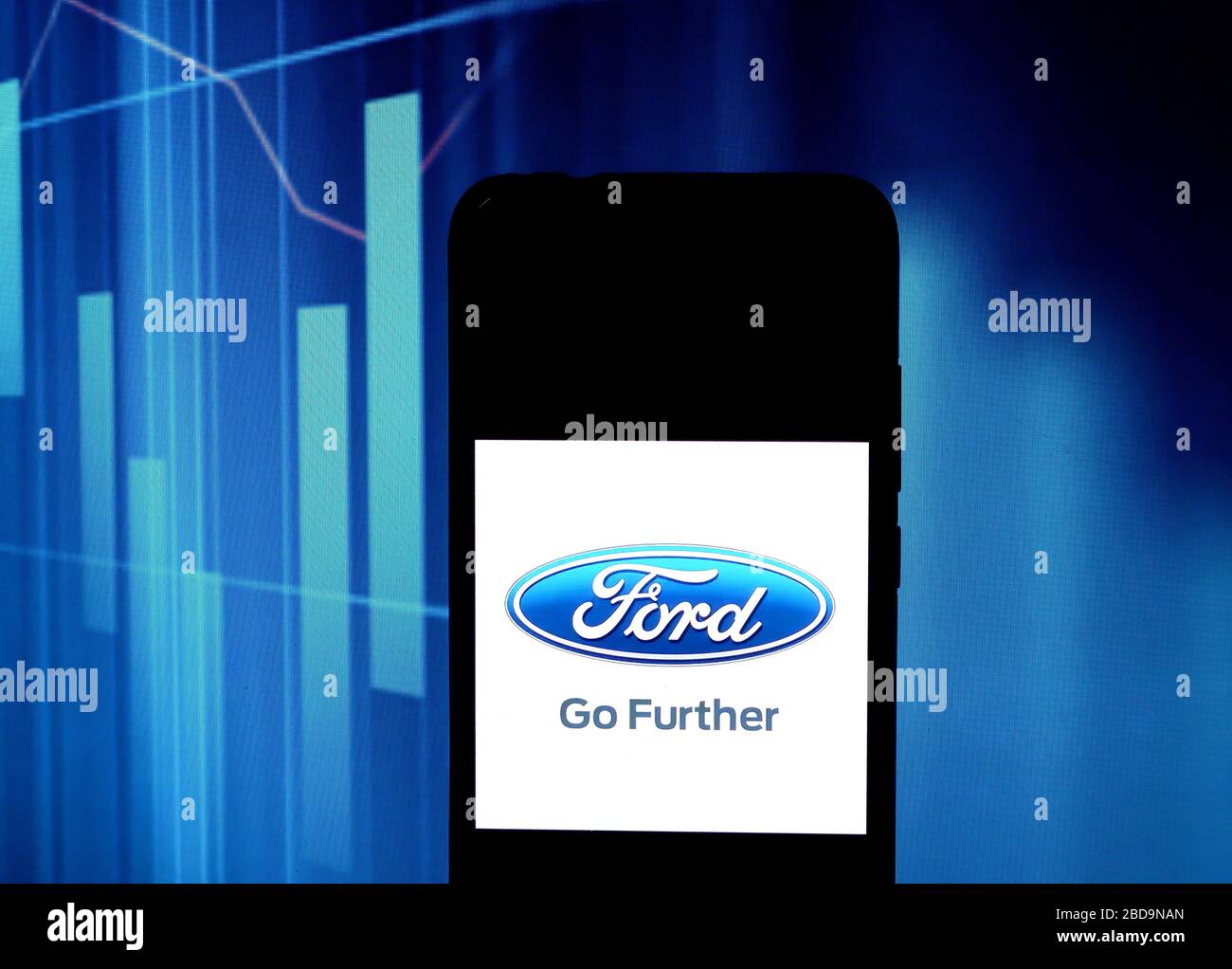 In this photo illustration a FORD Car logo seen displayed on a ...