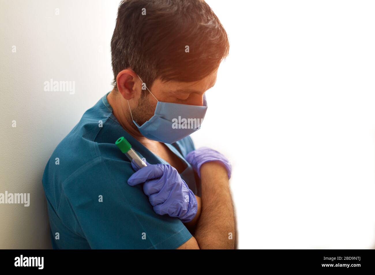 Overworked medical assistent sleeping in laboratory, sample blood test ...
