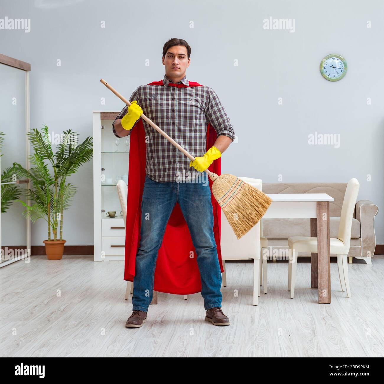 The super hero cleaner working at home Stock Photo - Alamy