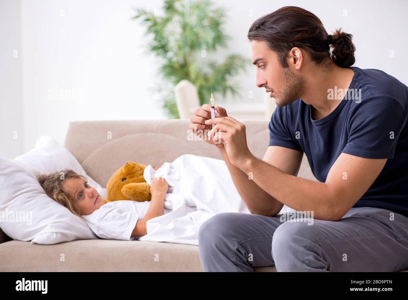 The father taking care of his ill daughter Stock Photo - Alamy