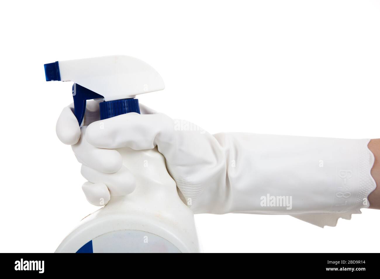 A gloved hands holding a spray bottle of cleaning, disinfecting ...